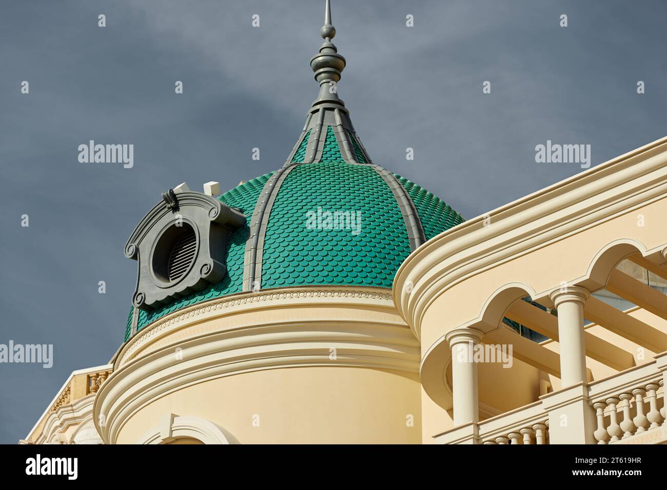 the facade of a famous building in Monaco with a picturesque green dome ...