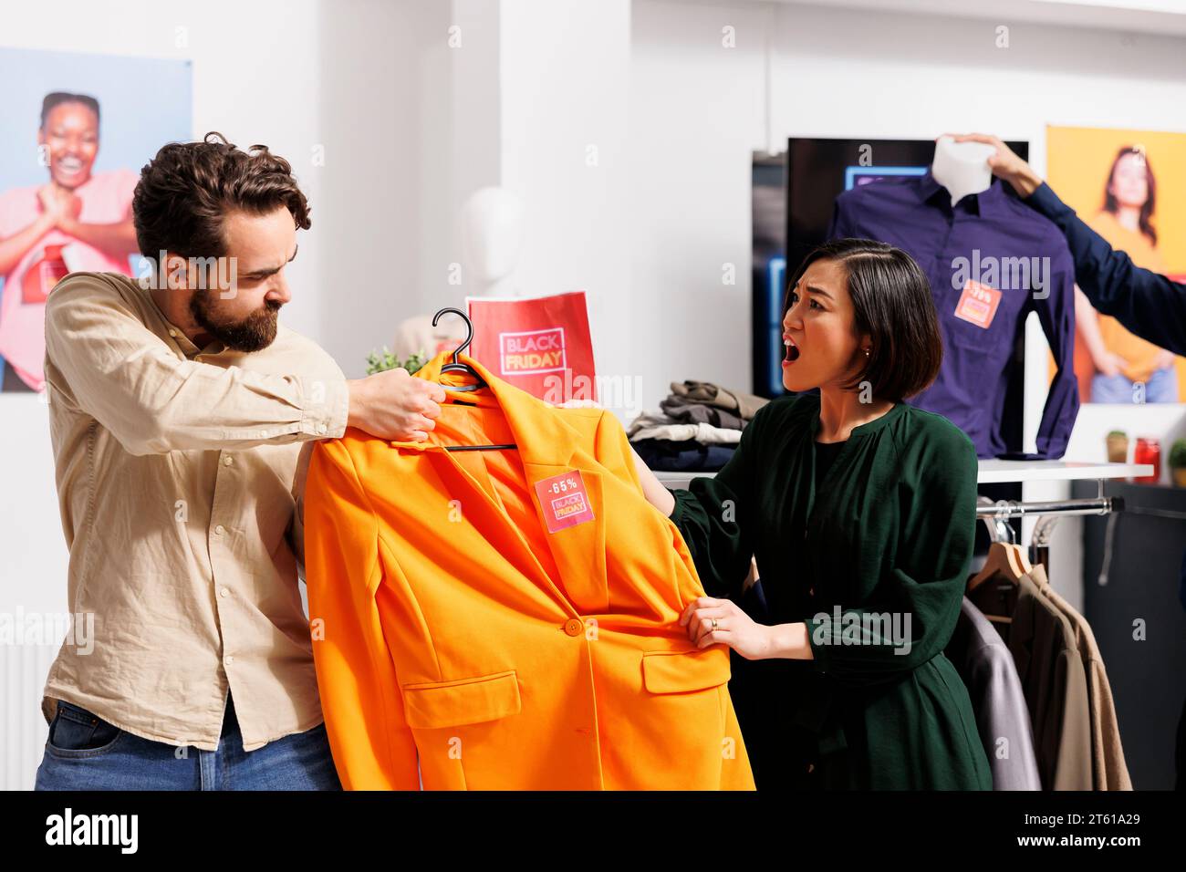 Brawl between two angry mad Black Friday shoppers in clothing store ...