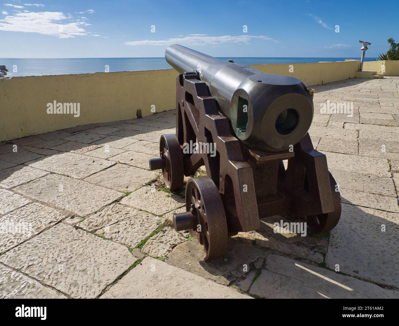 Iron Cannon Pointing Towards the Vast Ocean Horizon with blue sky ...