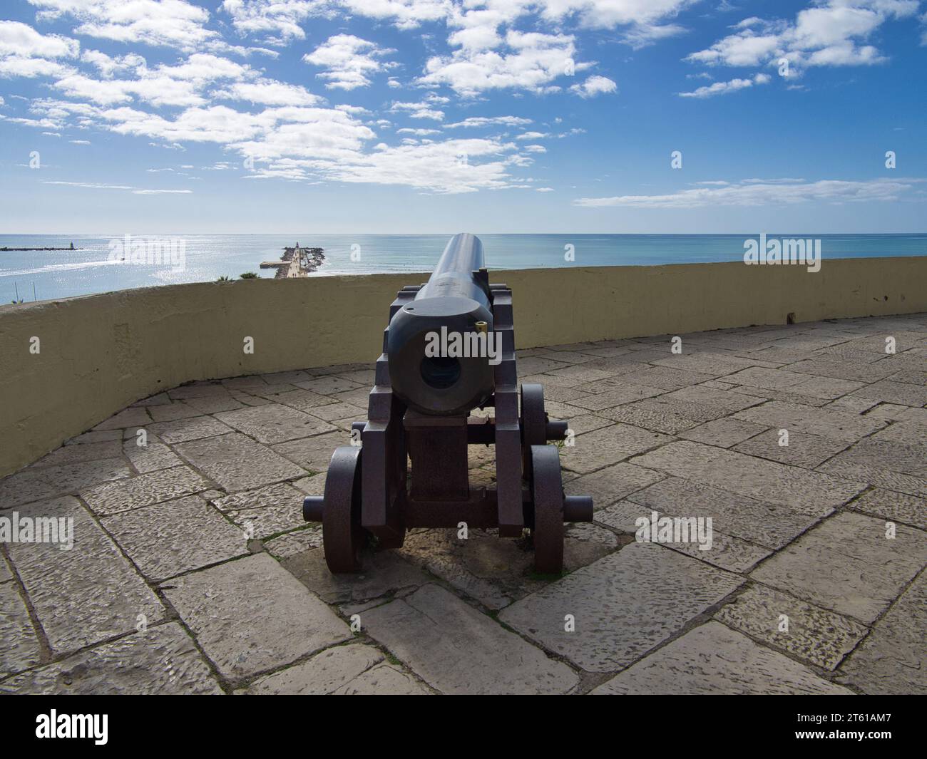 Iron Cannon Pointing Towards the Vast Ocean Horizon with blue sky ...