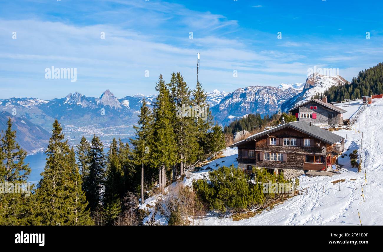 Lodge on Klewenalp mountain in Swiss Alps, Switzerland in winter. Lake ...