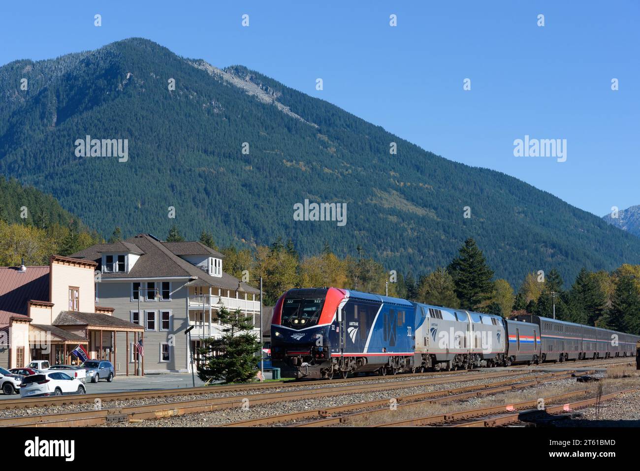 Skykomish, WA, USA - October 28, 2023; Amtrak Empire Builder train passing Cascade Mountains and ...