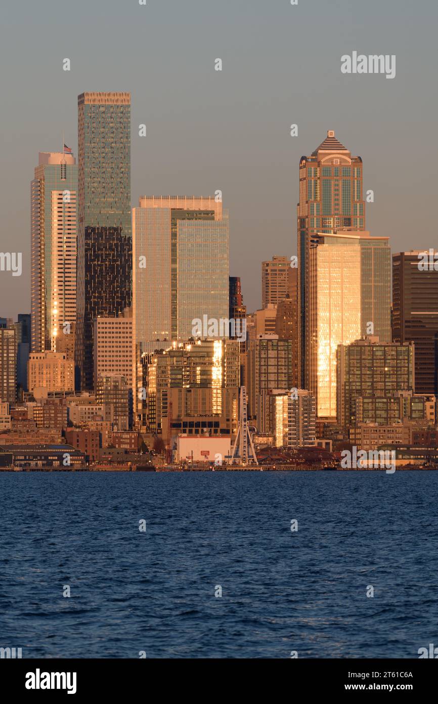 Seattle, WA, USA - October 28, 2023; Sunset golden light reflecting on ...