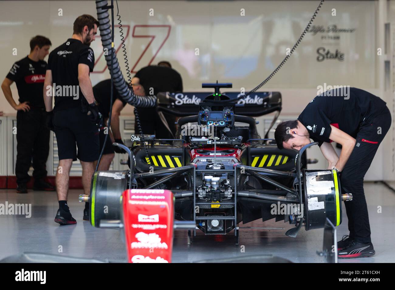 MECHANICS working on the ALFA ROMEO F1 TEAM STAKE car at the garage as part of the 2023 F1 Sao ...