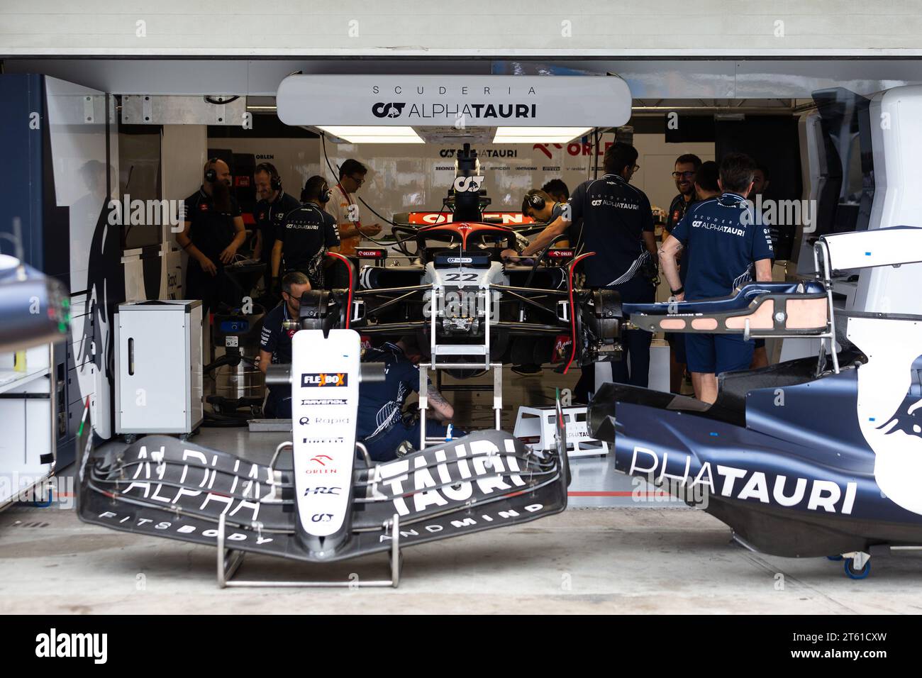 MECHANICS working on the SCUDERIA ALPHATAURI car at the garage as part of the 2023 F1 Sao Paulo ...