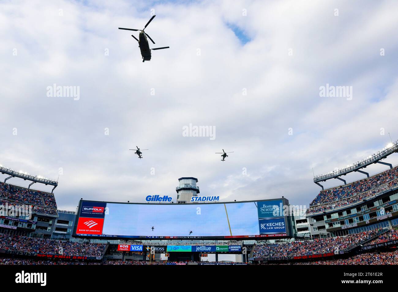 A general view as military helicopters fly over Gillette Stadium before ...