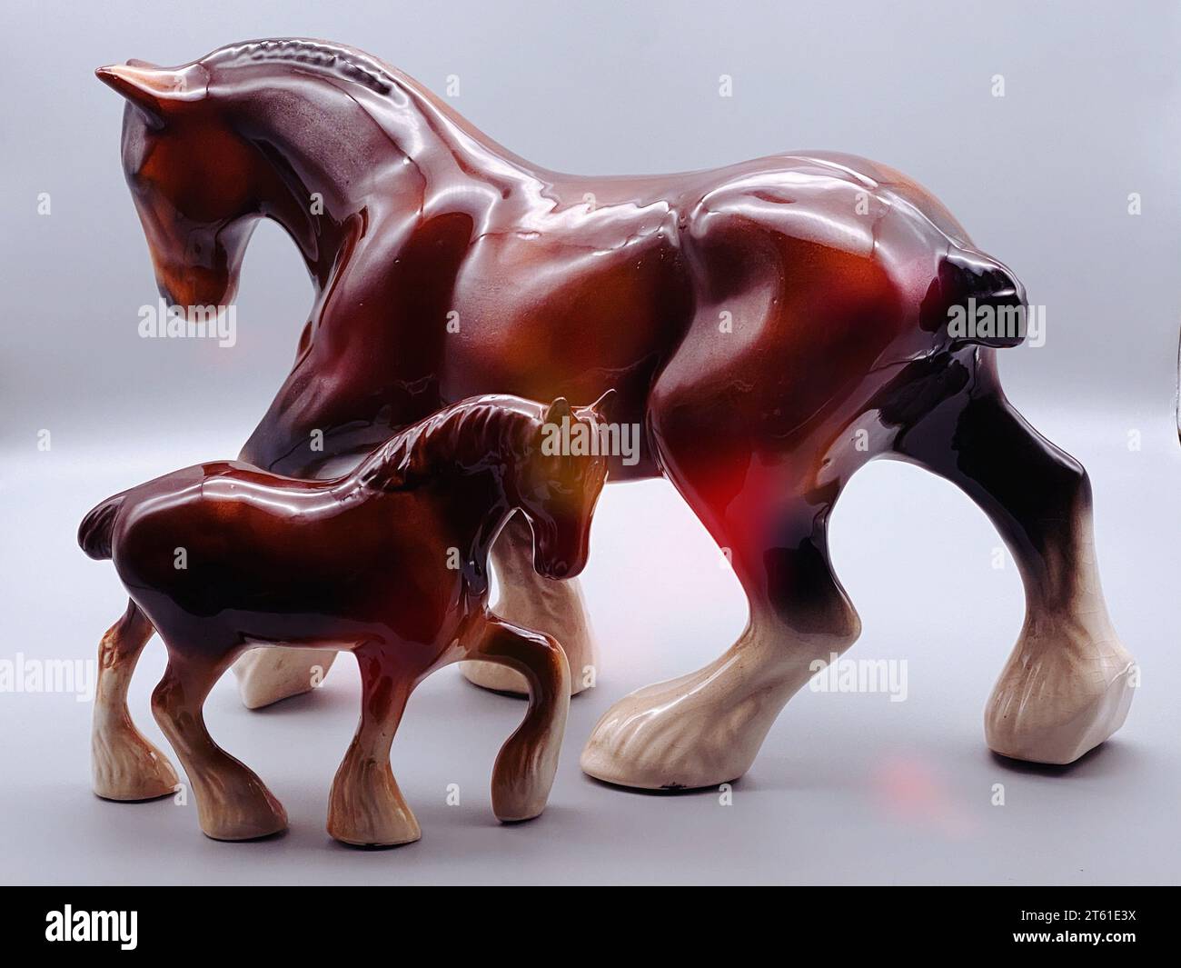 A set of plastic horse figurines on a crisp white background Stock ...