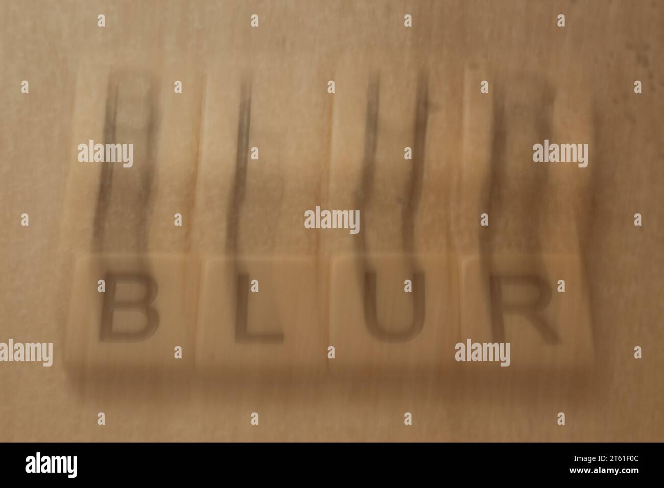 Letters spell out BLUR in a blurry manner. Four tiles reading blur in a ...