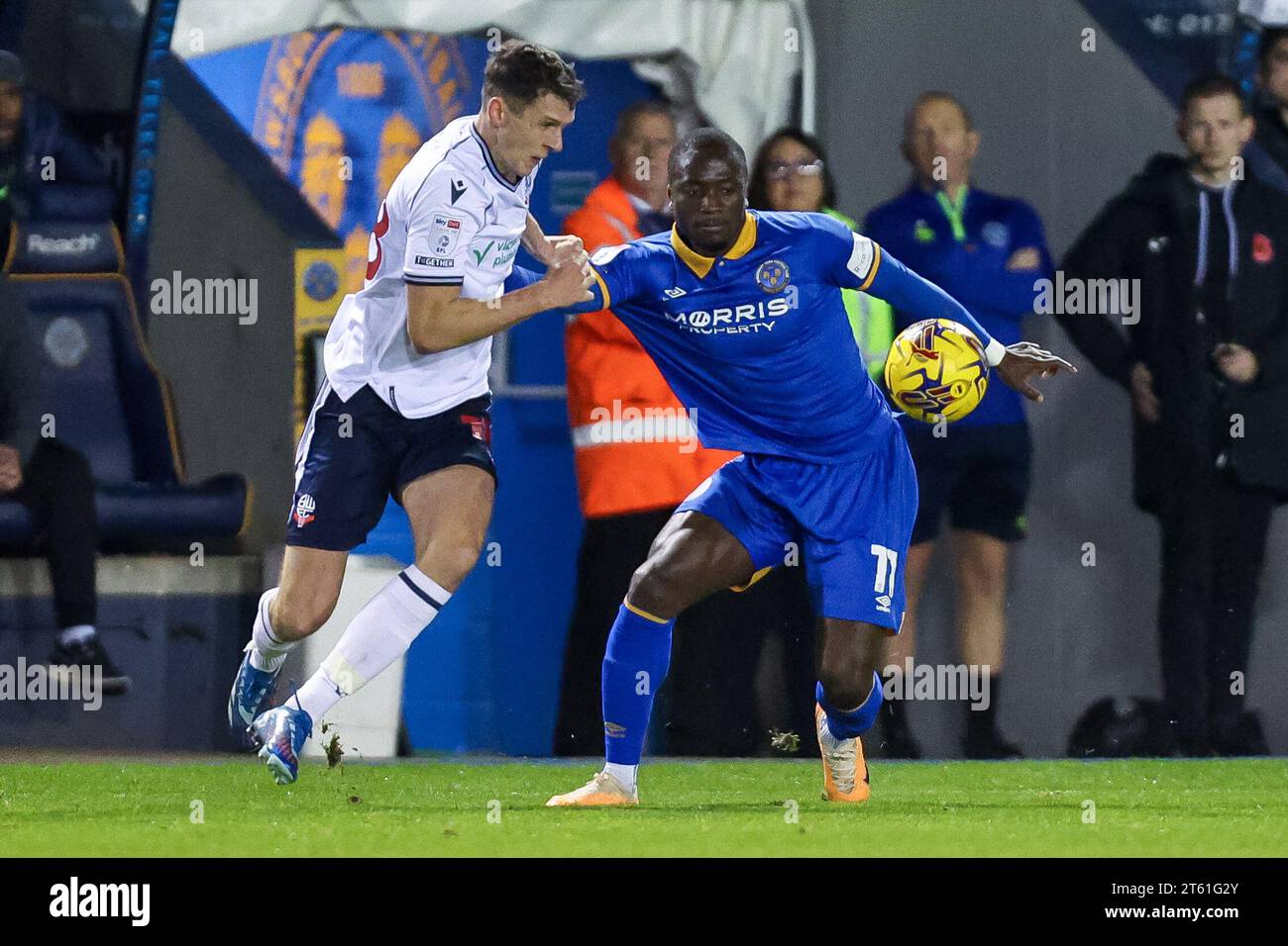 Shrewsbury, UK. 07th Nov, 2023. Bolton's Eoin Toal & Shrewsbury's ...