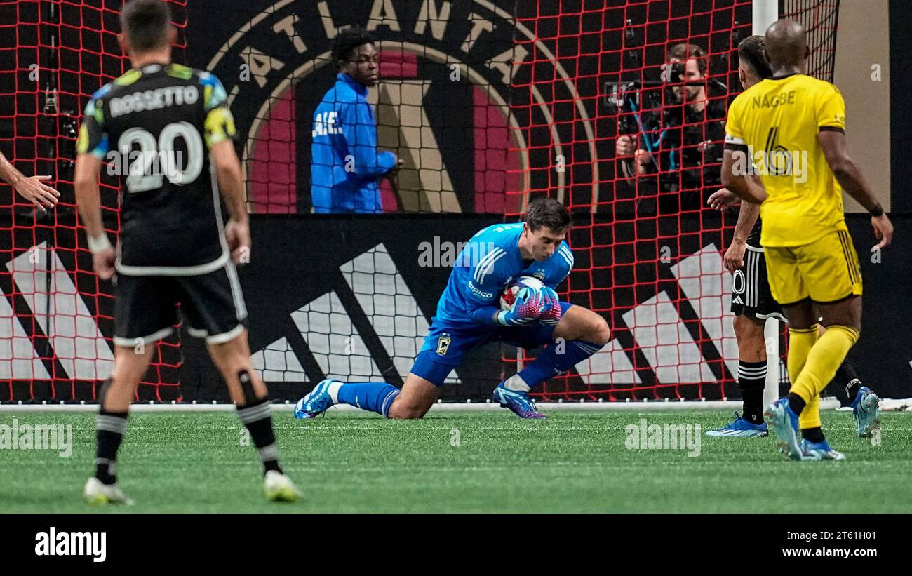 Columbus Crew goalkeeper Patrick Schulte (28) makes a save against ...