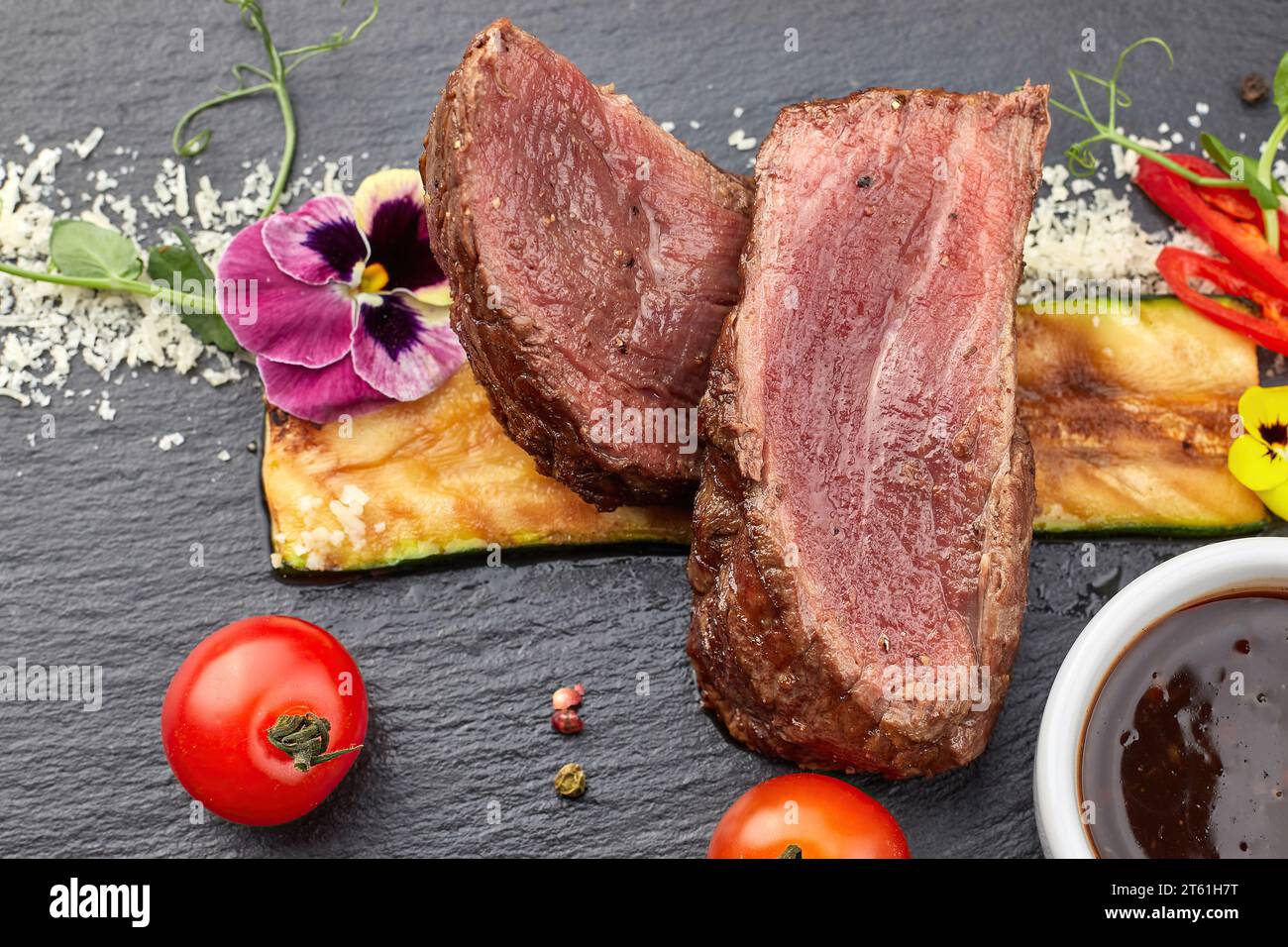 Filet Mignon steak with sauce on black slate Stock Photo - Alamy