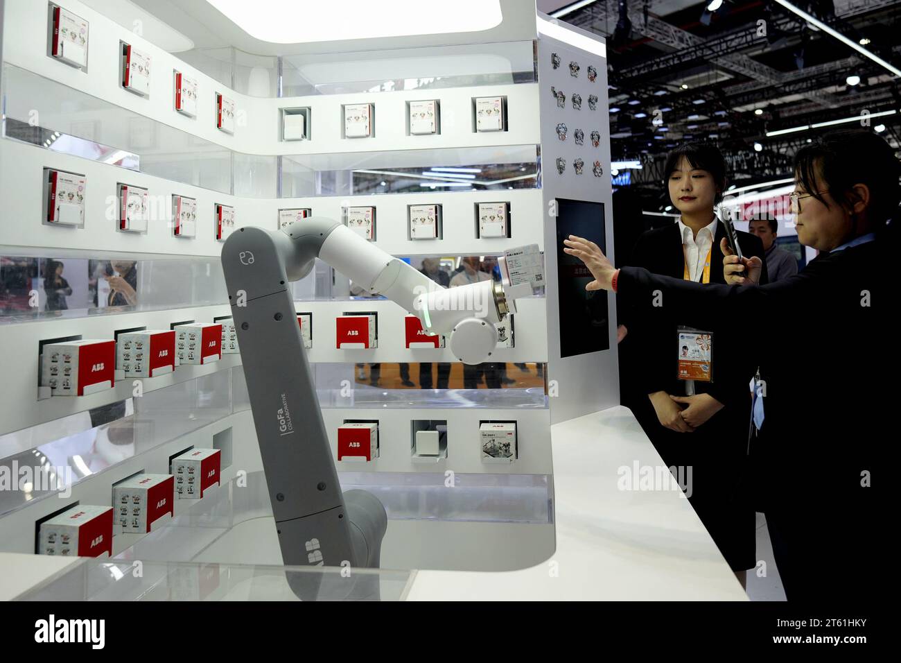 Shanghai. 7th Nov, 2023. A visitor interacts with a robot at the booth ...