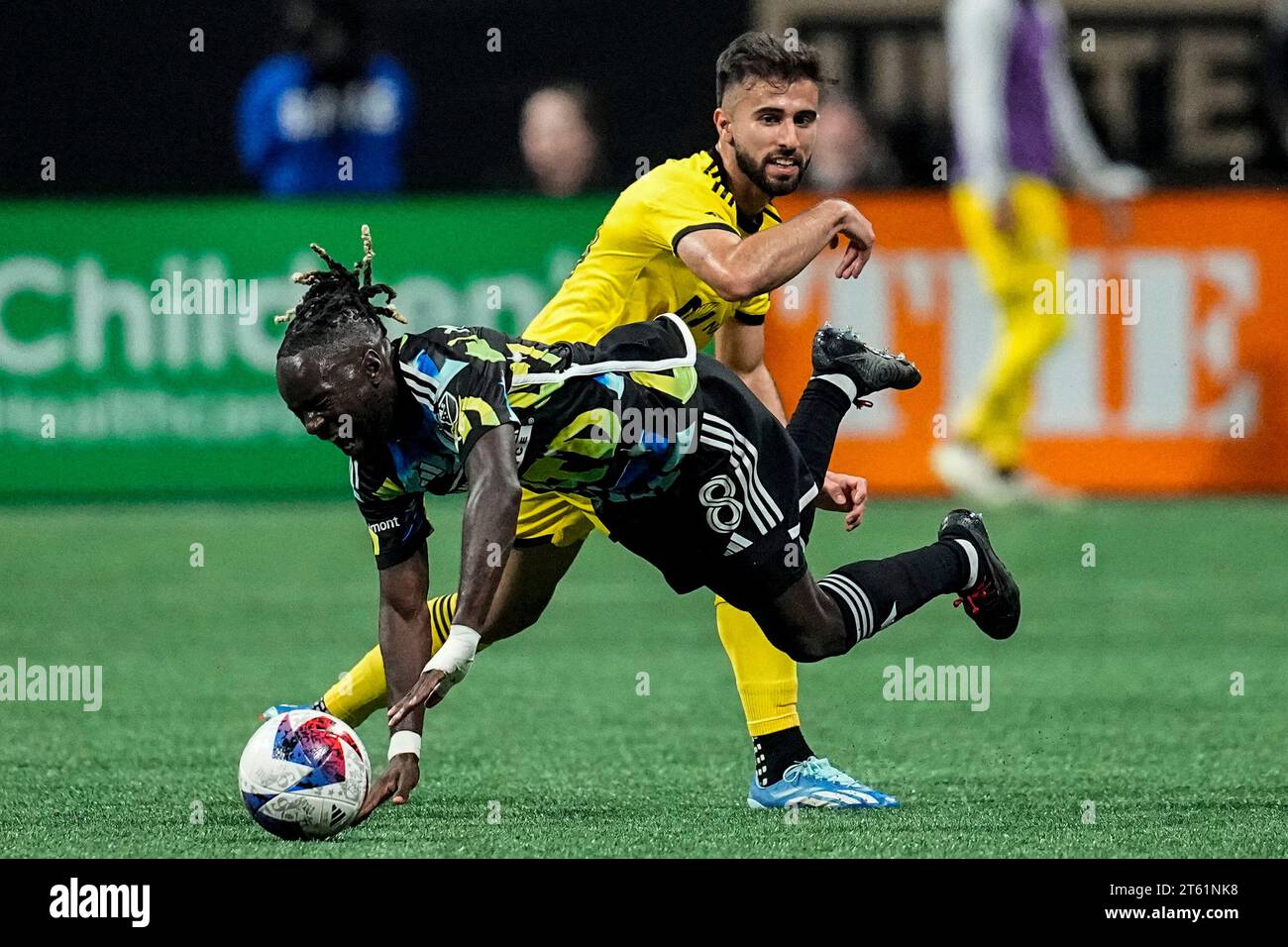 Atlanta United midfielder Tristan Muyumba (8) falls to the pitch ...
