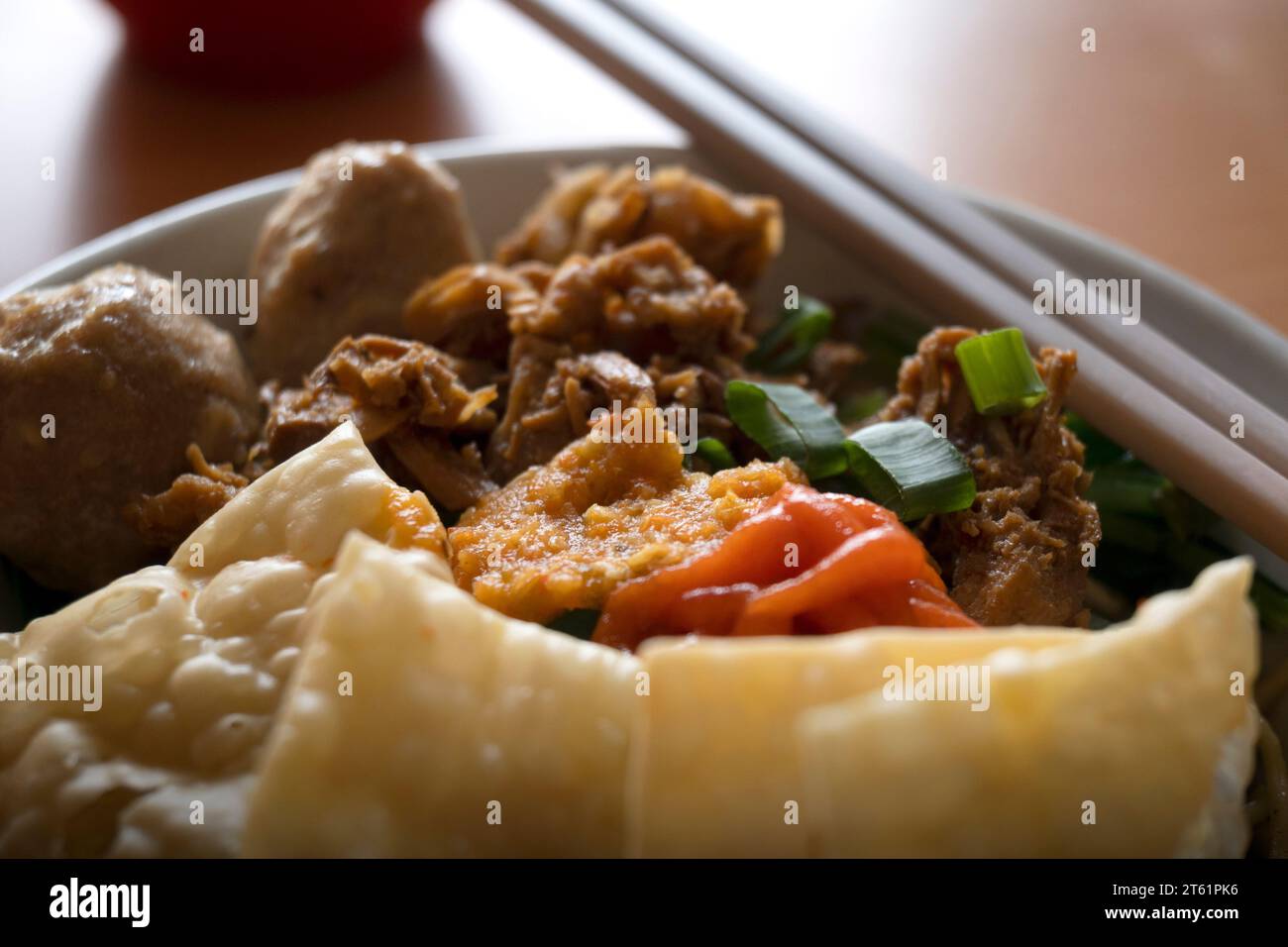 Chicken noodles (Mie Ayam) in the bowl are ready to serve. Traditional ...