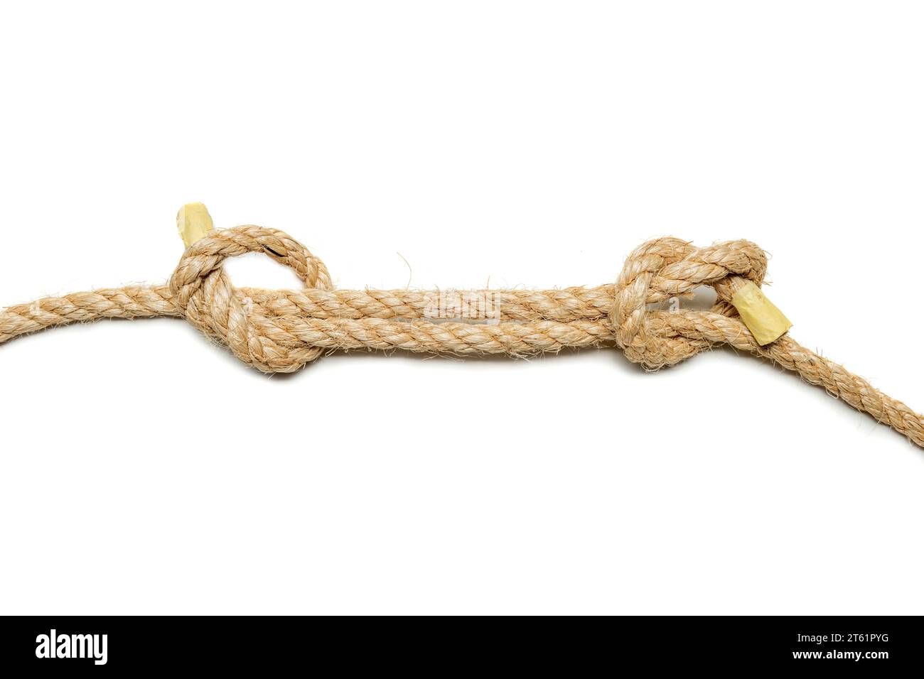 Coiled rope knot isolated over a white background Stock Photo - Alamy