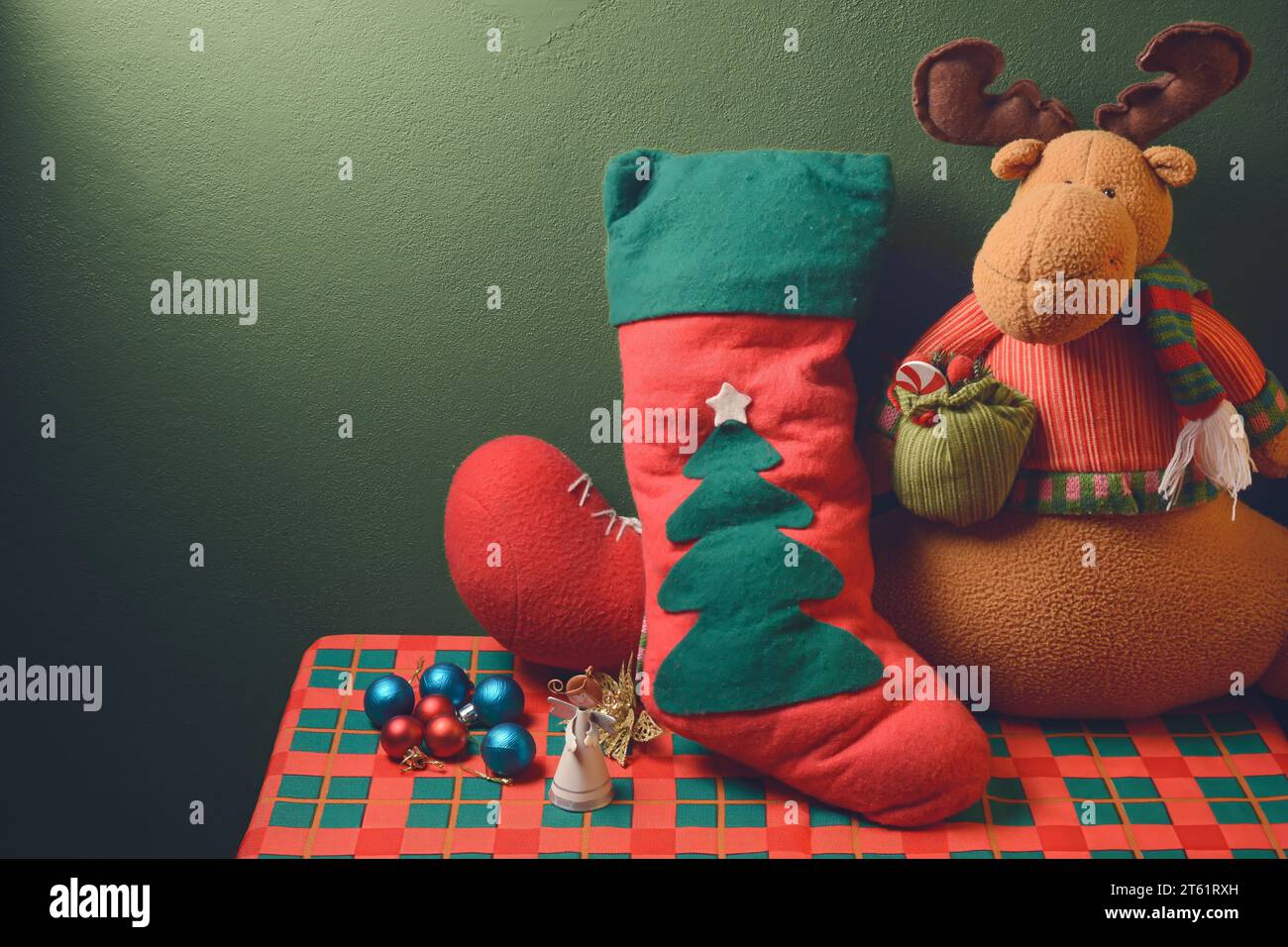 Christmas decoration, ornaments on table against flat wall. Christmas ...