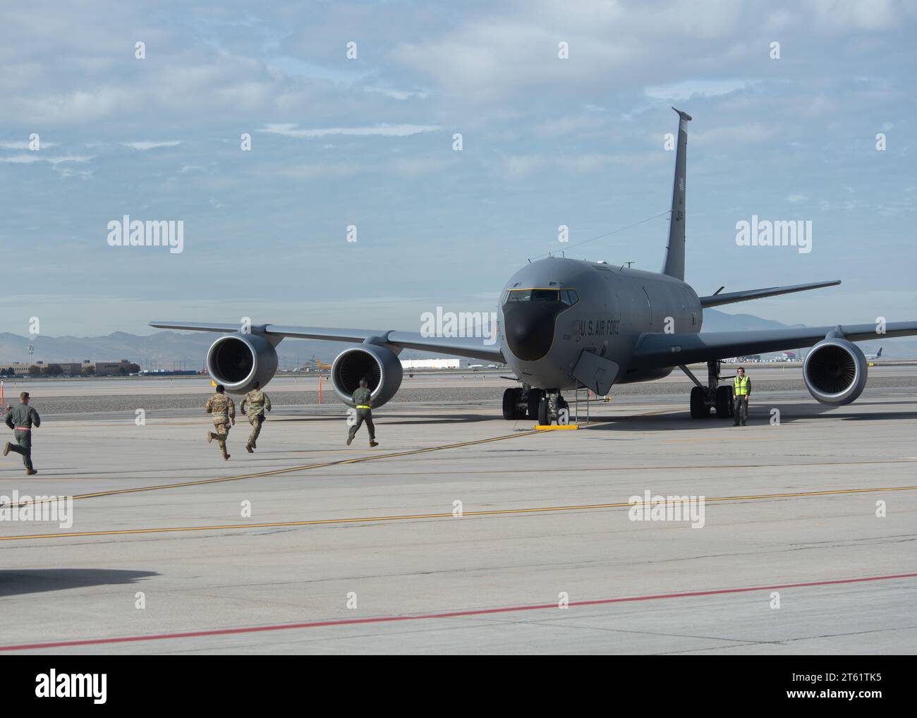 Members of the Air operations squadron rush to start engines on the KC ...