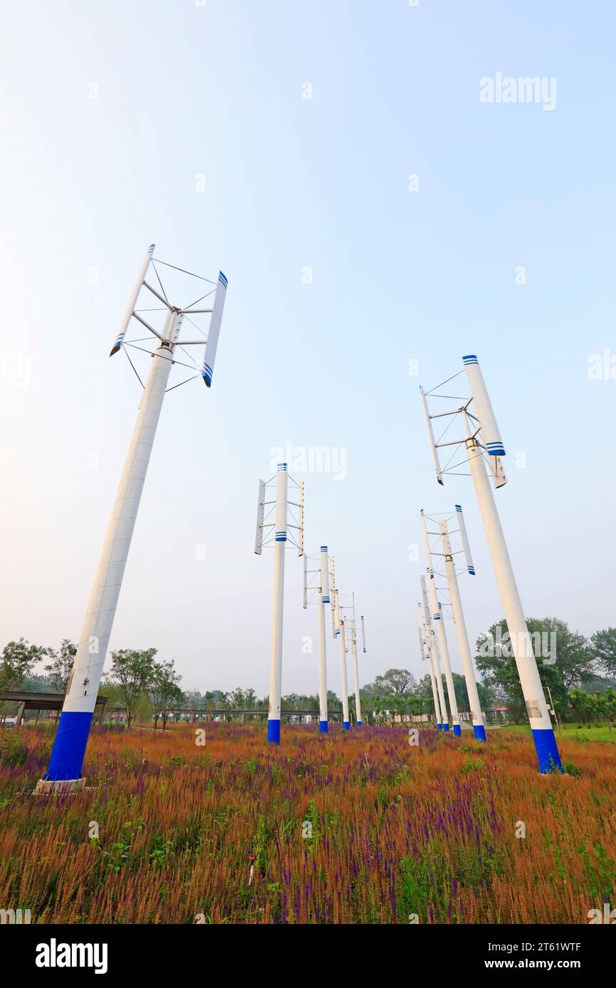 vertical axis wind turbine under blue sky Stock Photo - Alamy