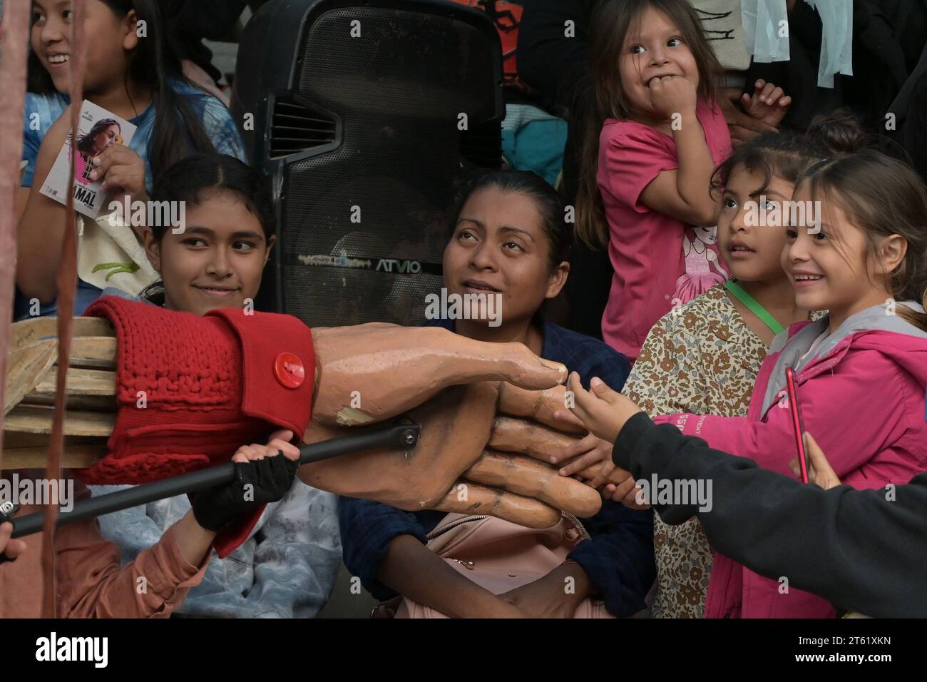 Tijuana, Mexico. 07th Nov, 2023. Migrant children reach out to touch ...
