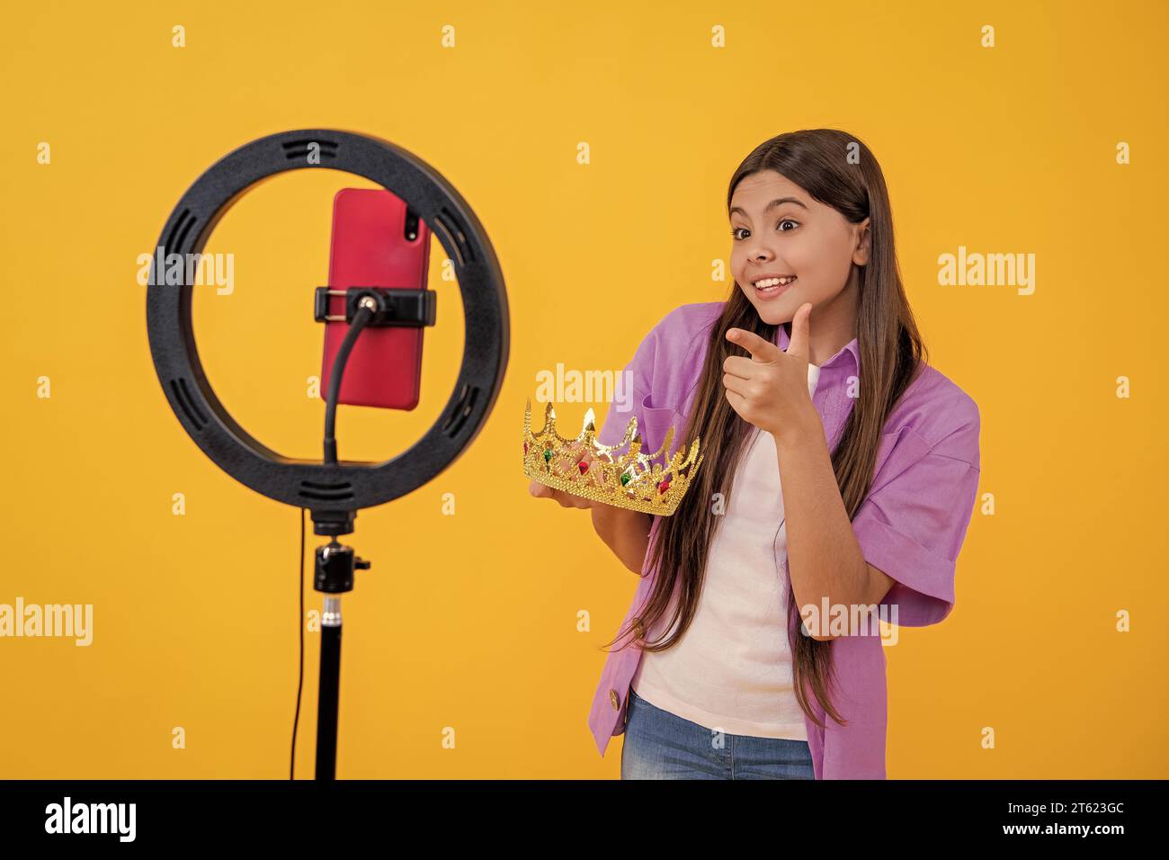 teen girl influencer with crown, pointing finger. teen girl influencer ...