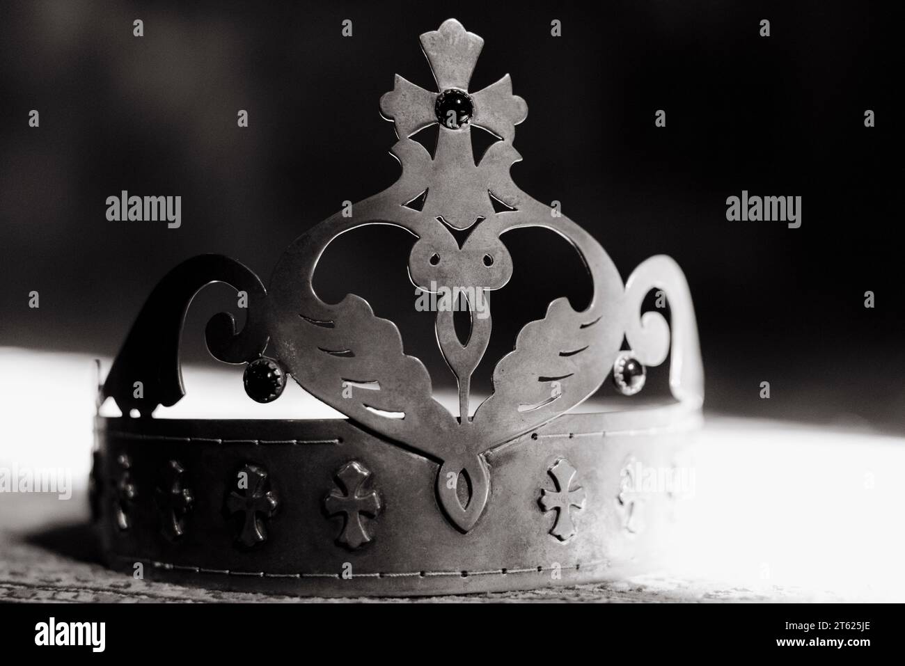A closeup of a crown with a cross in a church in grayscale Stock Photo ...