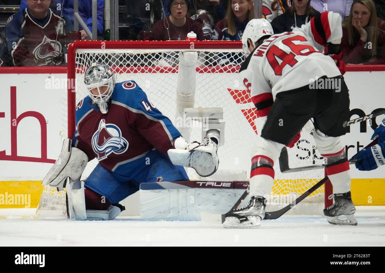 Colorado Avalanche goaltender Alexandar Georgiev, left, stops a shot by ...