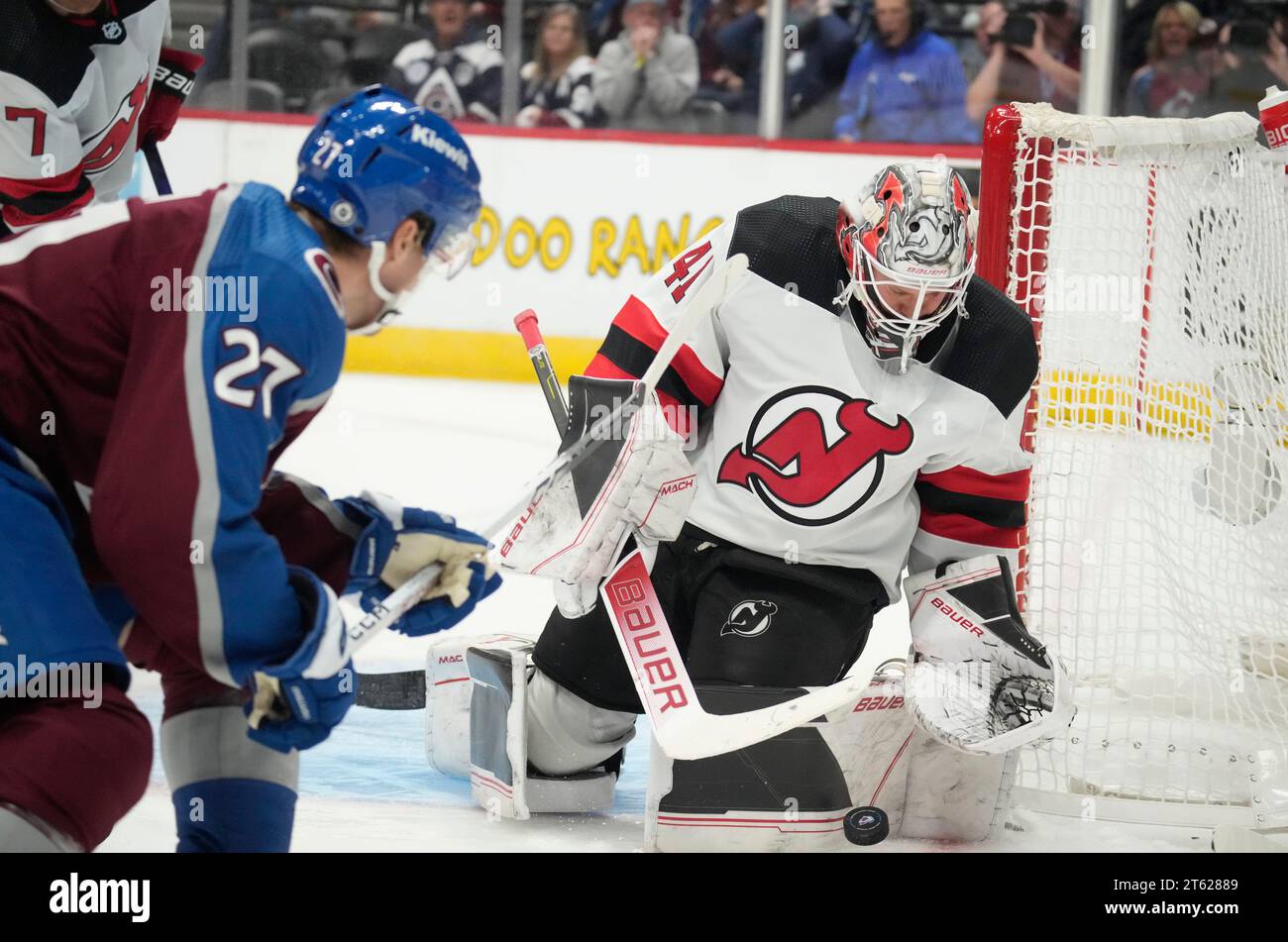 New Jersey Devils goaltender Vitek Vanecek, right, makes a pad save of ...