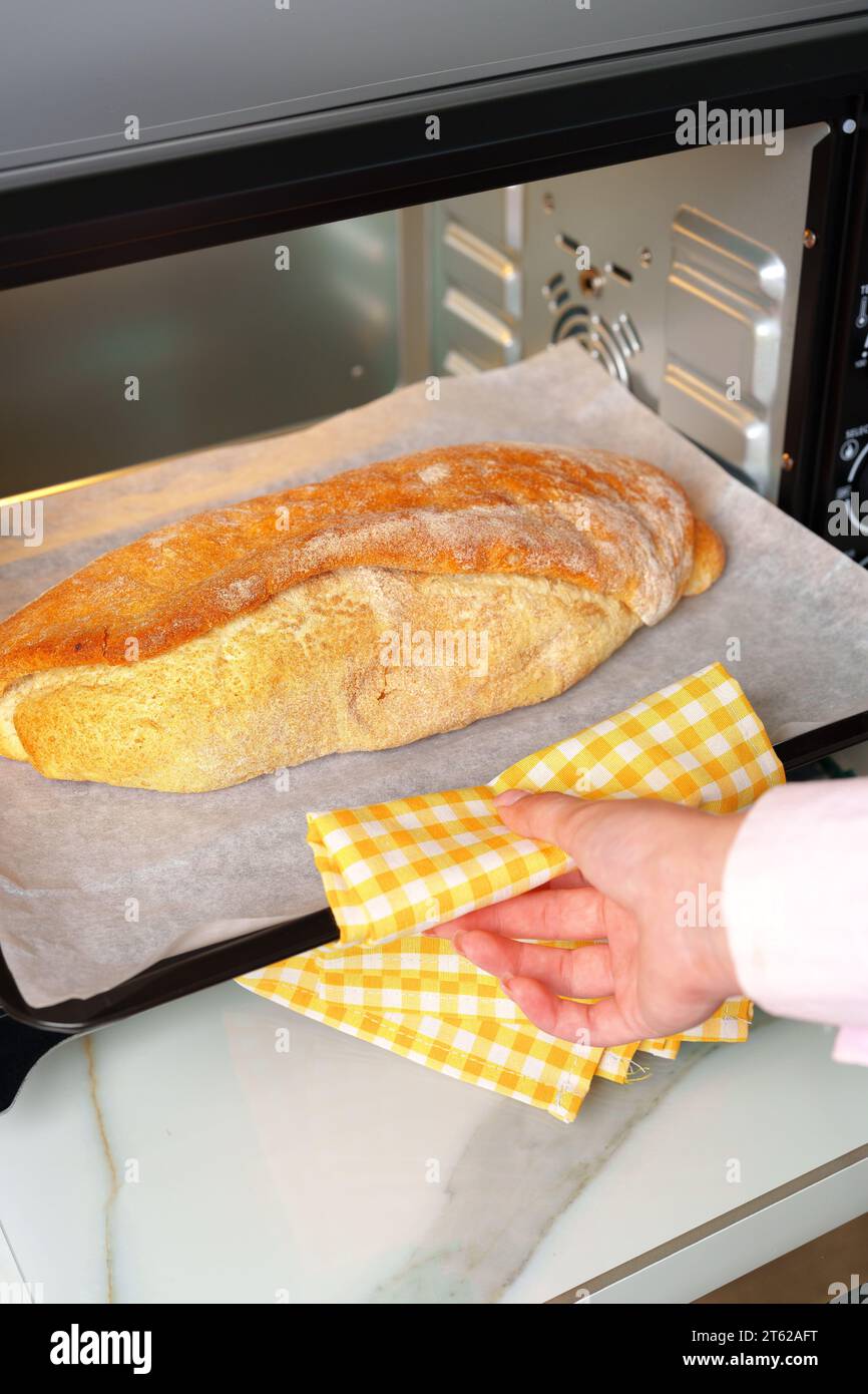 Woman hands open fresh bread hi-res stock photography and images - Alamy