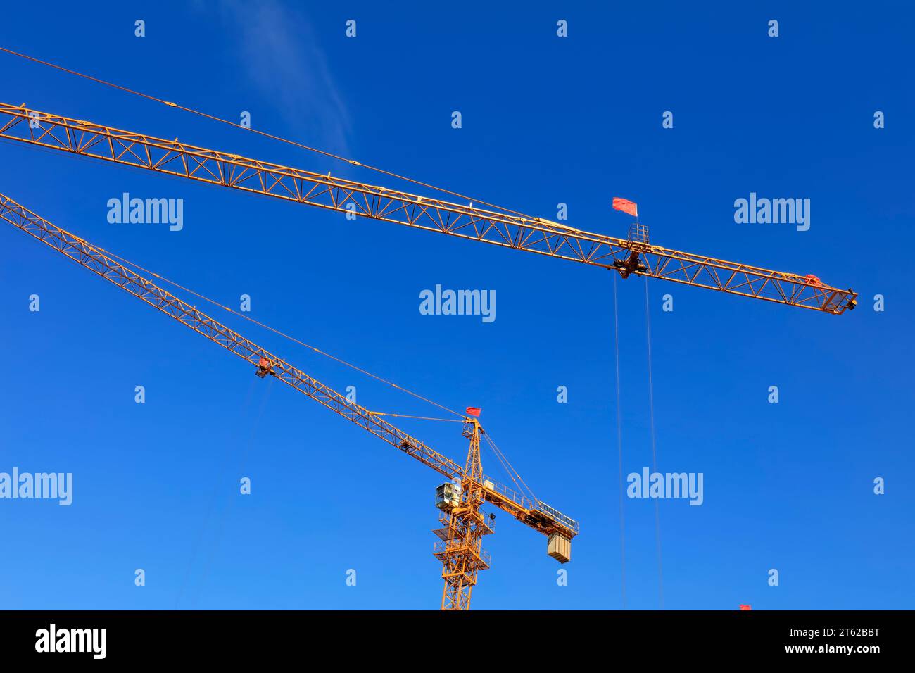 Tower crane arm in the blue sky background Stock Photo - Alamy