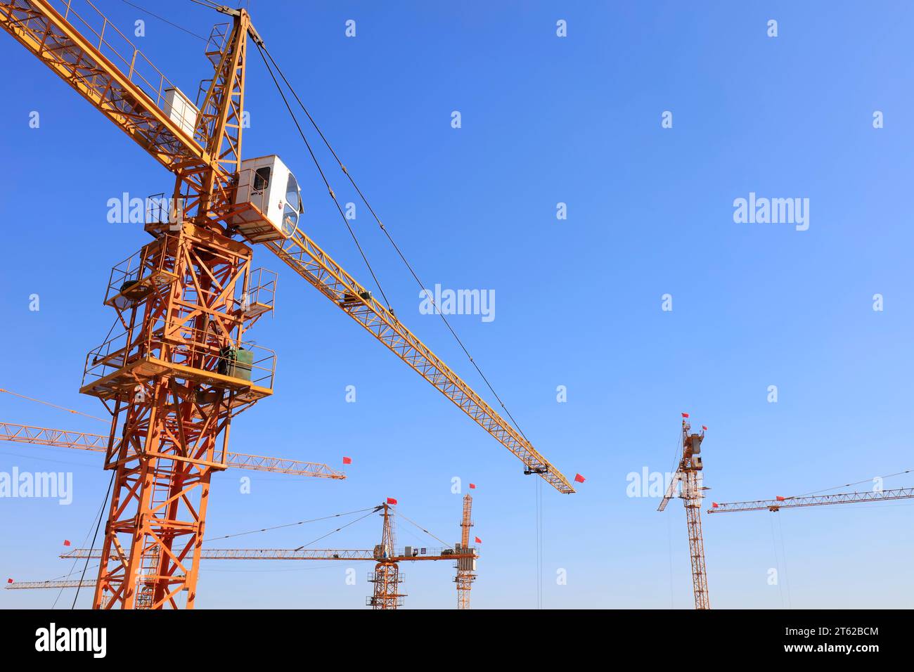 Tower crane arm in the blue sky background Stock Photo - Alamy