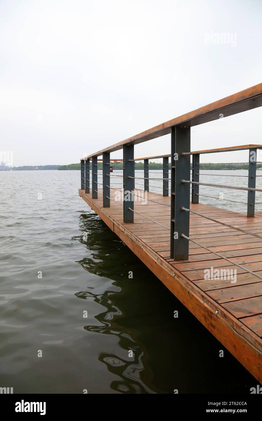 wooden platform at the water side Stock Photo - Alamy