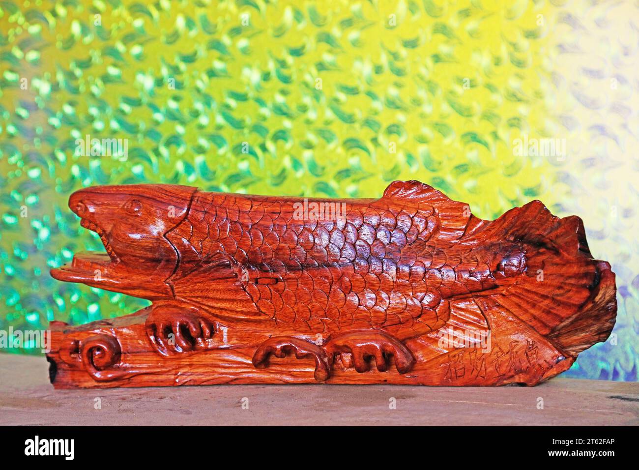 Carvings of golden dragon fish Stock Photo - Alamy