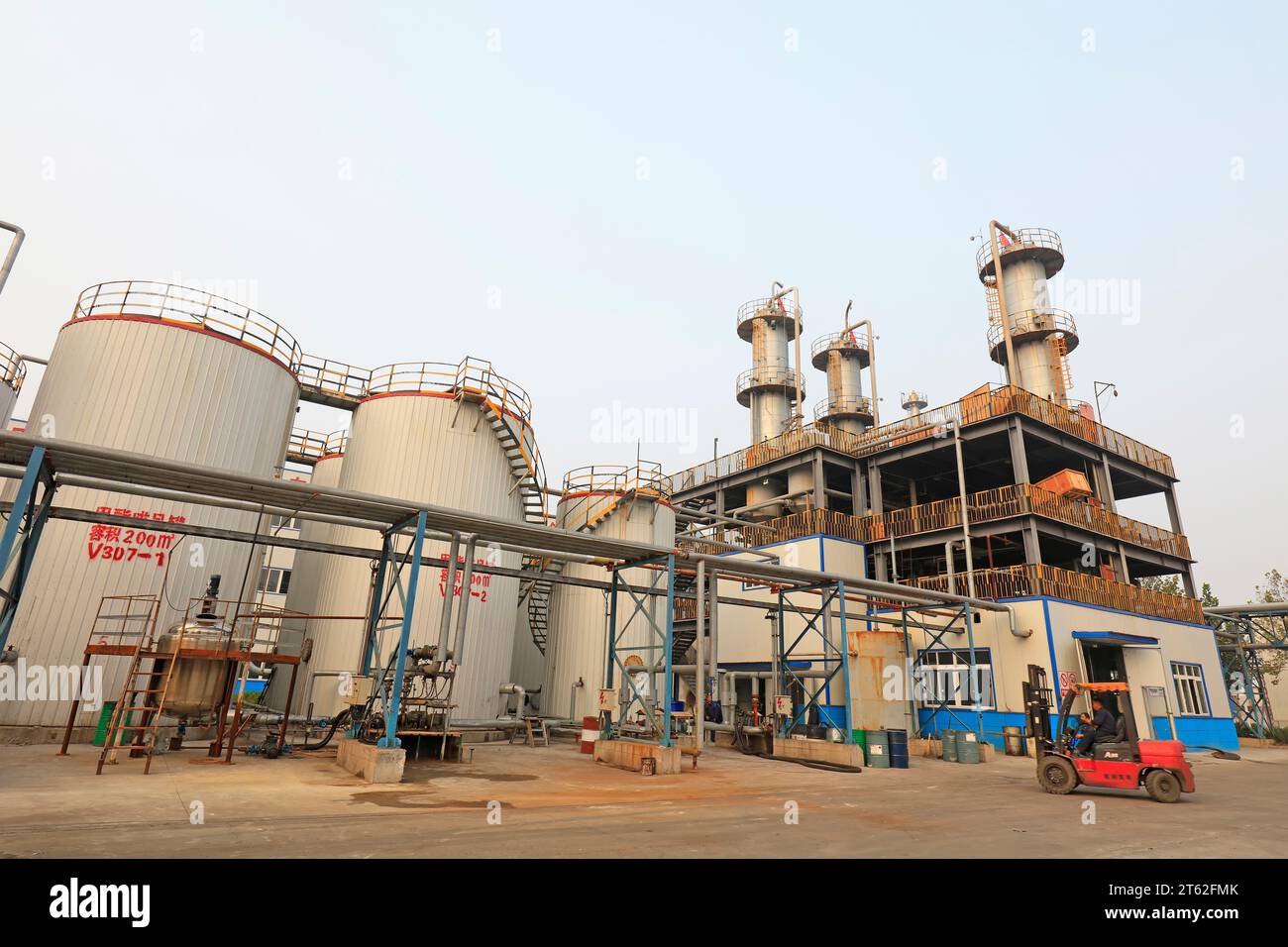 Distillation equipment and oil storage tank Stock Photo - Alamy