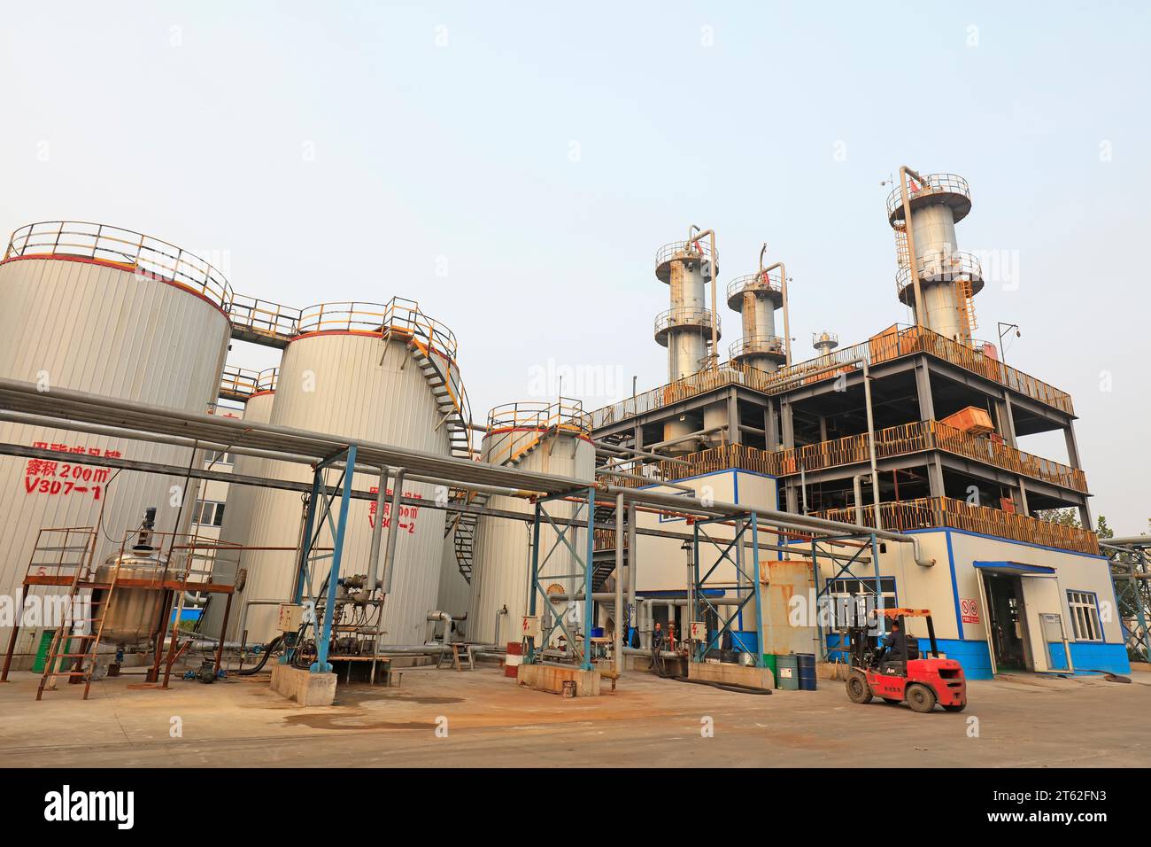Distillation equipment and oil storage tank Stock Photo - Alamy