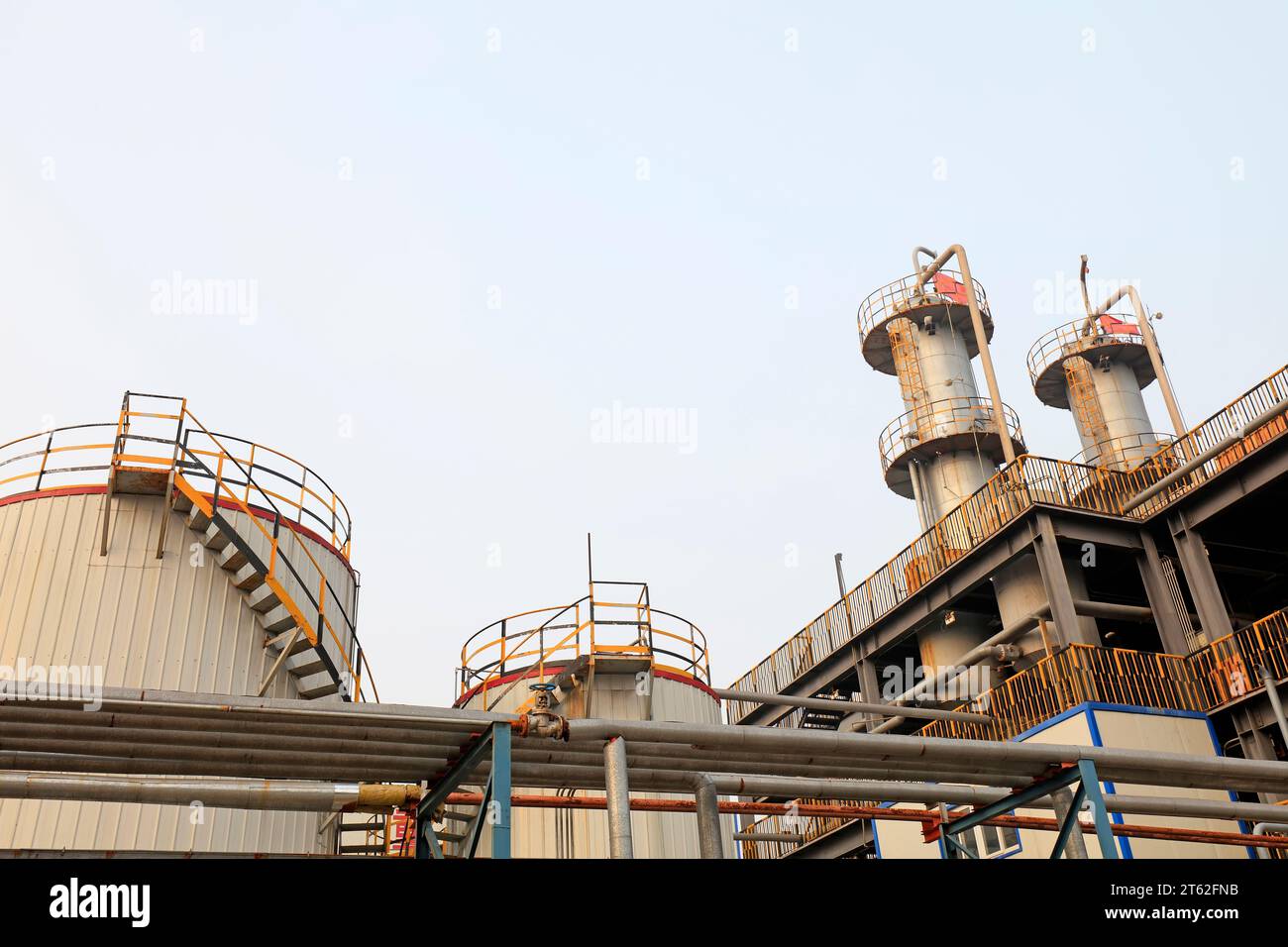 Distillation equipment and oil storage tank Stock Photo - Alamy