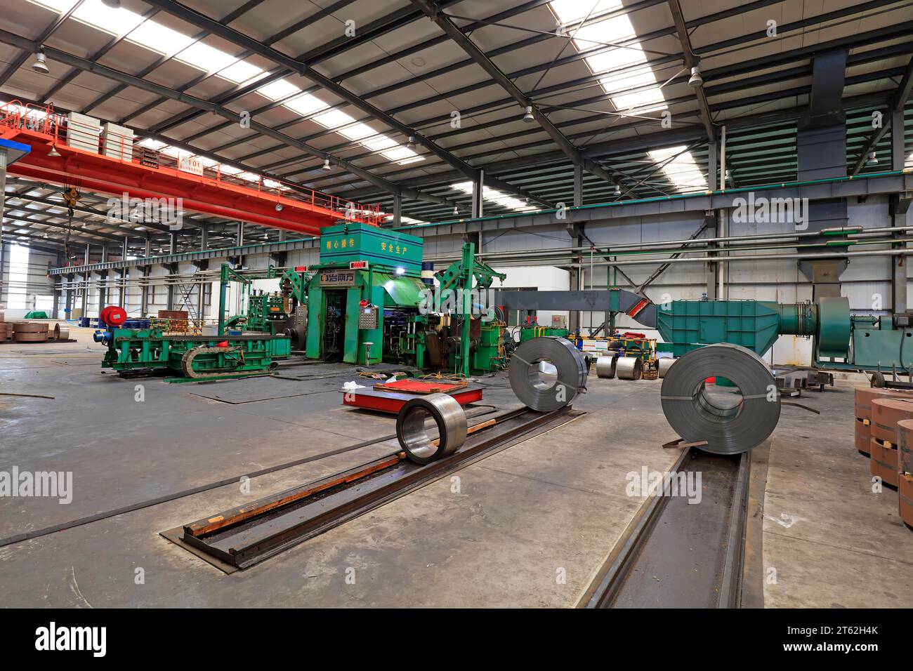 Strip steel and machinery in the workshop Stock Photo - Alamy