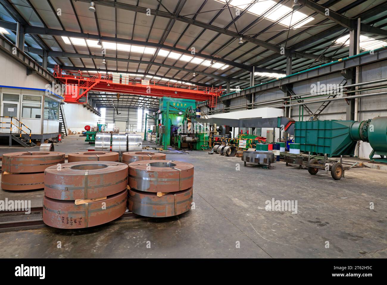 Strip steel and machinery in the workshop Stock Photo - Alamy