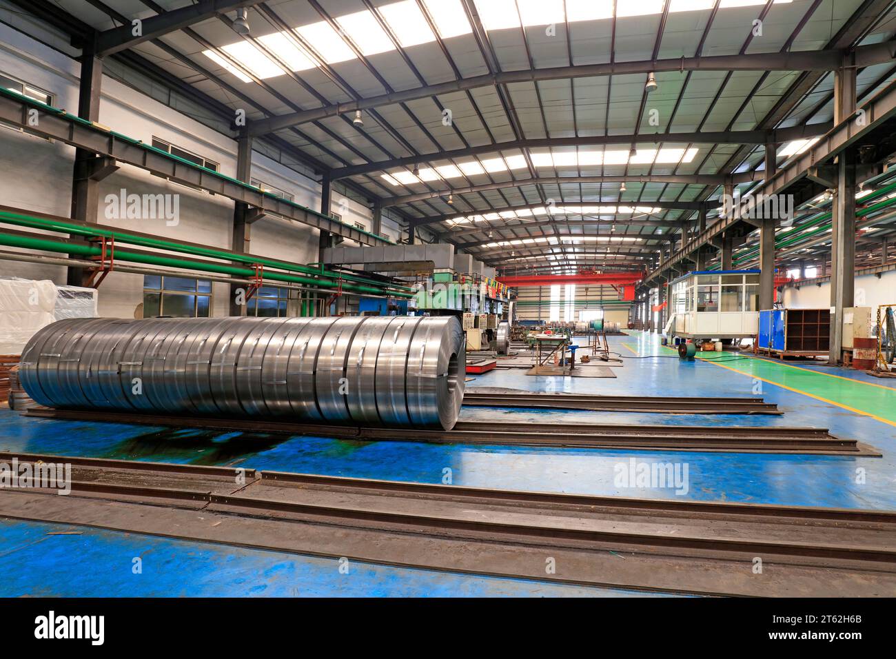 Strip steel and machinery in the workshop Stock Photo - Alamy