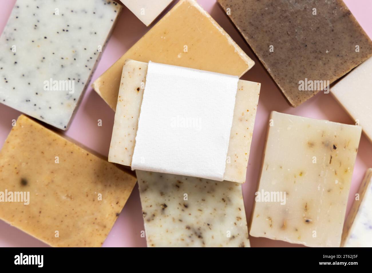 Beige and brown handmade soap bars on light pink top view, soap ...