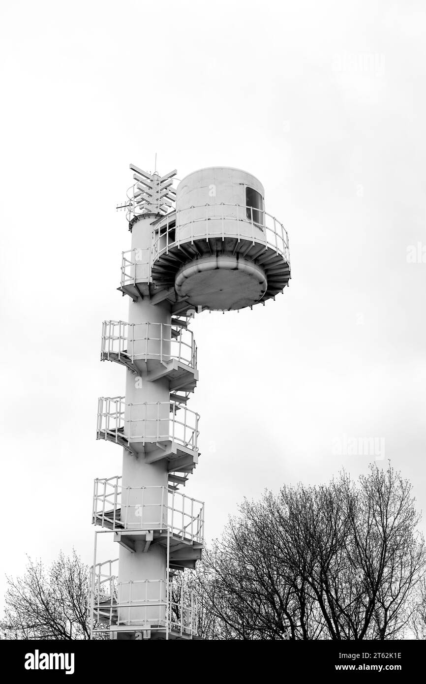 Navigation tower at the port of Swinoujscie. Tower on the beach of the ...