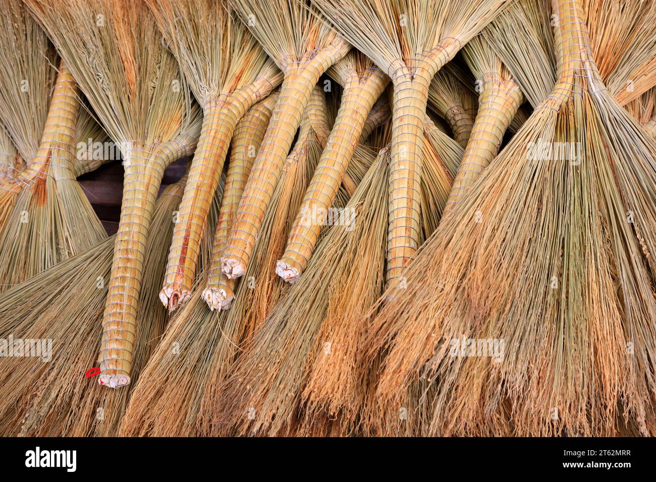 brooms piled up Stock Photo - Alamy