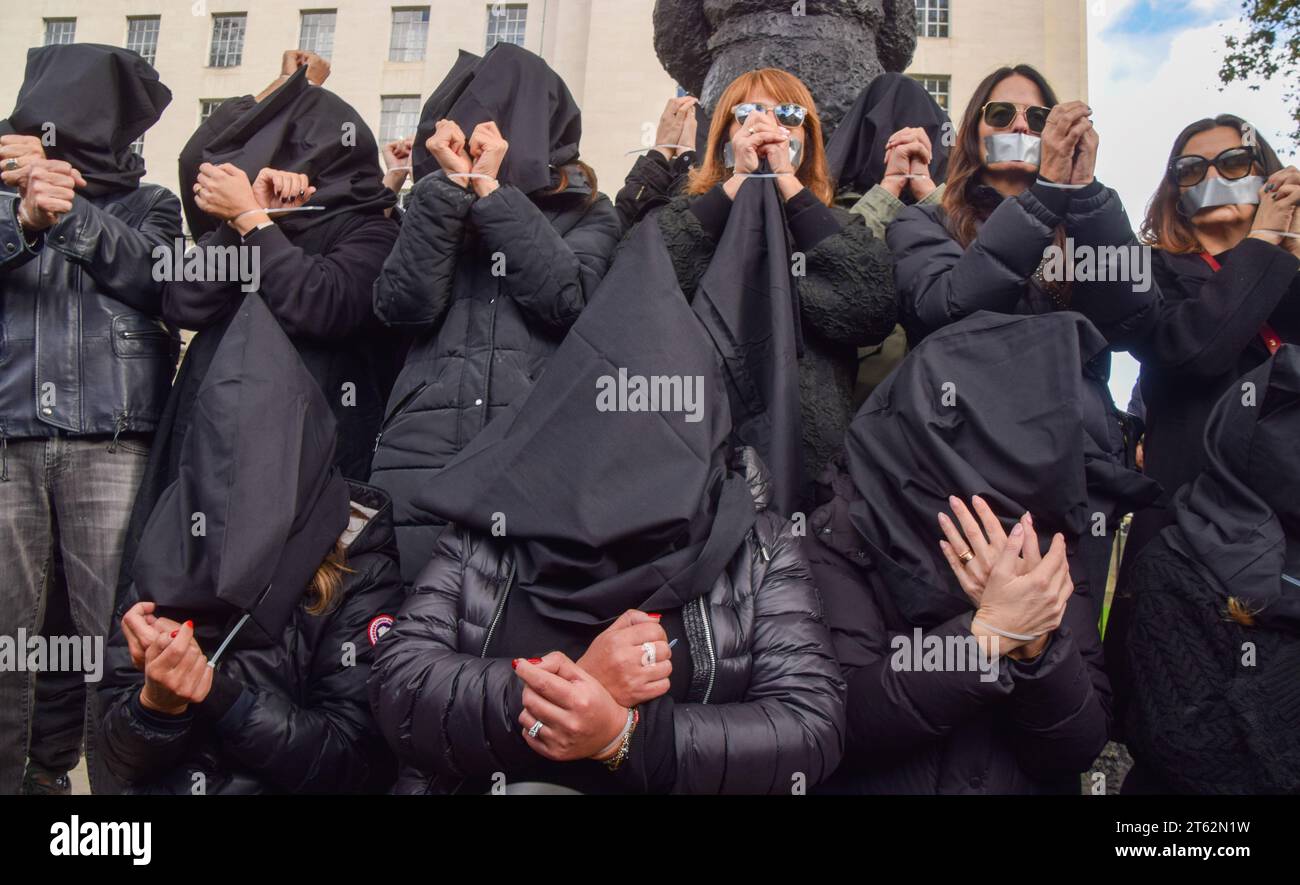 London, England, UK. 7th Nov, 2023. Protesters have their hands tied ...