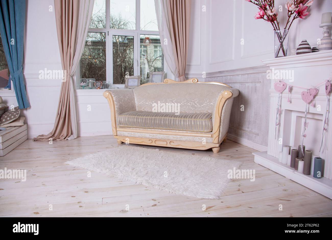 Old sofa in room interior. Armchair with wooden planks. Empire style ...