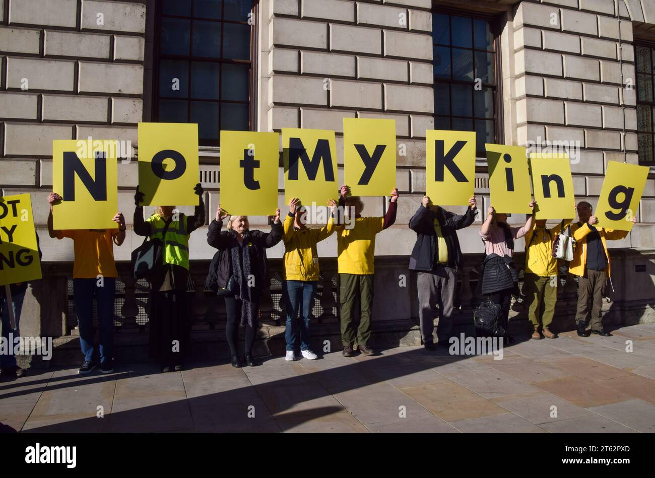 London, UK. 7th November 2023. Protesters hold up Not My King placards ...