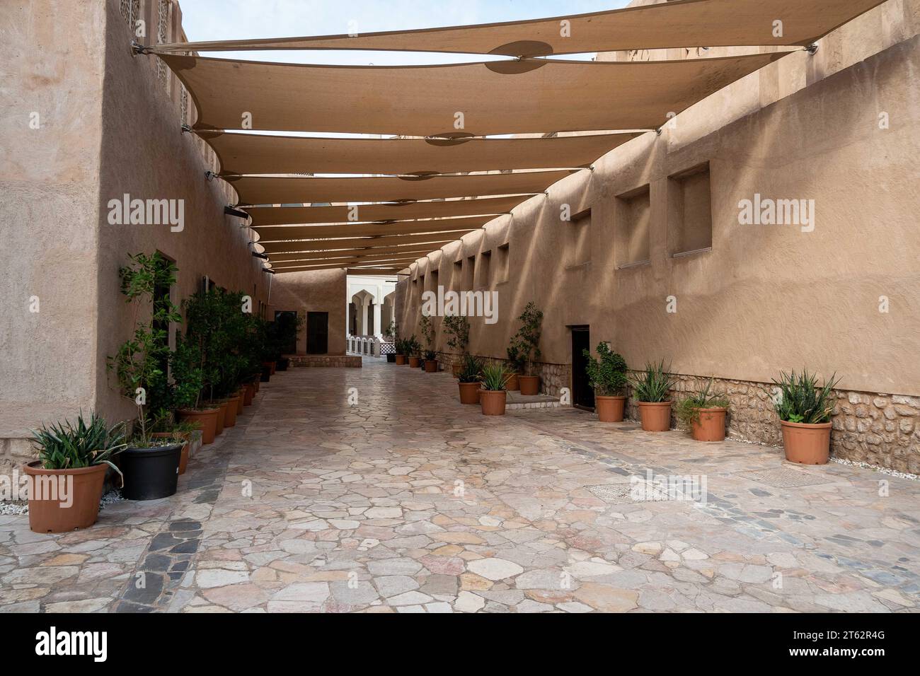 View of narrow clean streets between traditional stone buildings in old ...