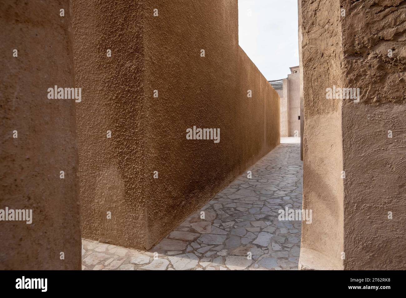 View of narrow clean streets between traditional stone buildings in old ...