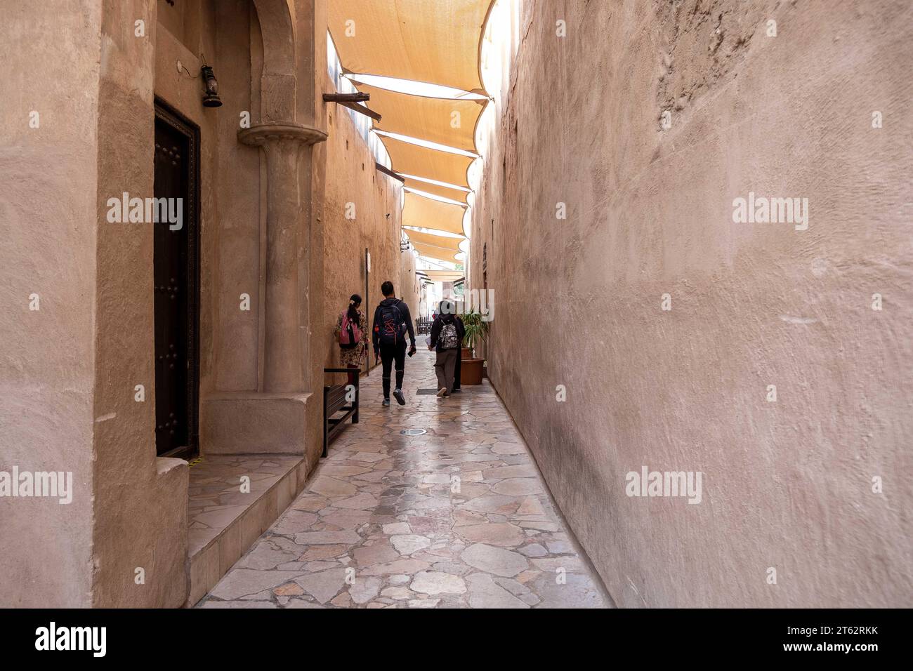 View of narrow clean streets between traditional stone buildings in old ...