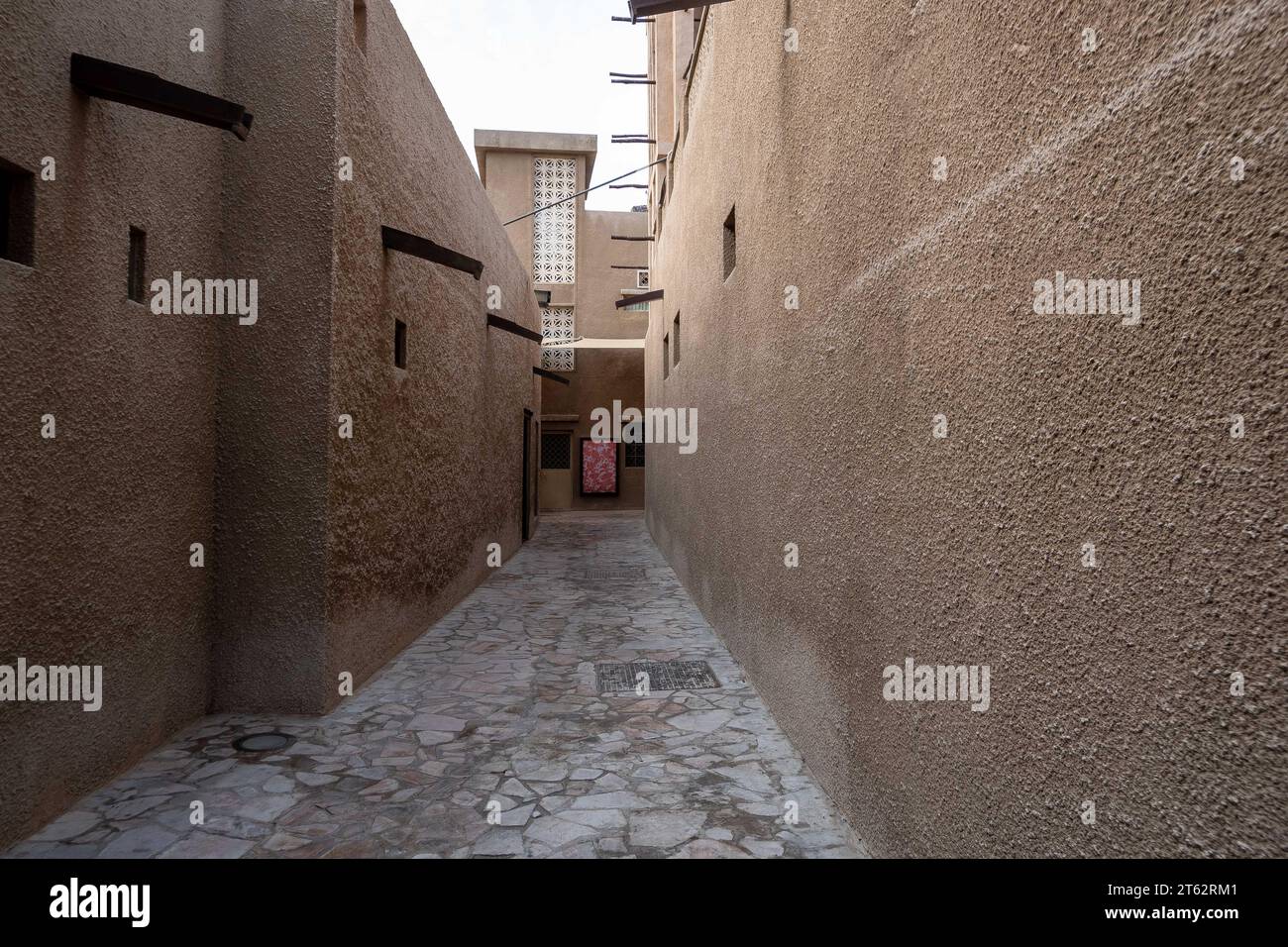 View of narrow clean streets between traditional stone buildings in old ...