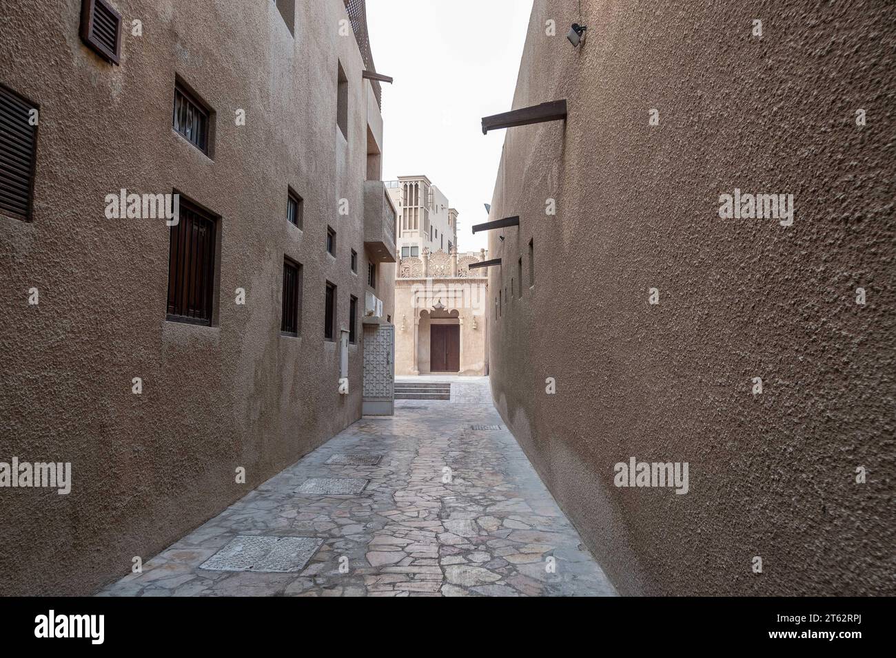 View of narrow clean streets between traditional stone buildings in old ...