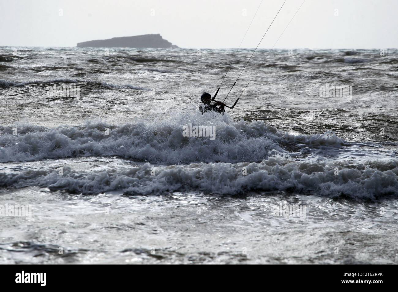 Kite surfing on beach Varkiza during the storm, brought about by a cold ...